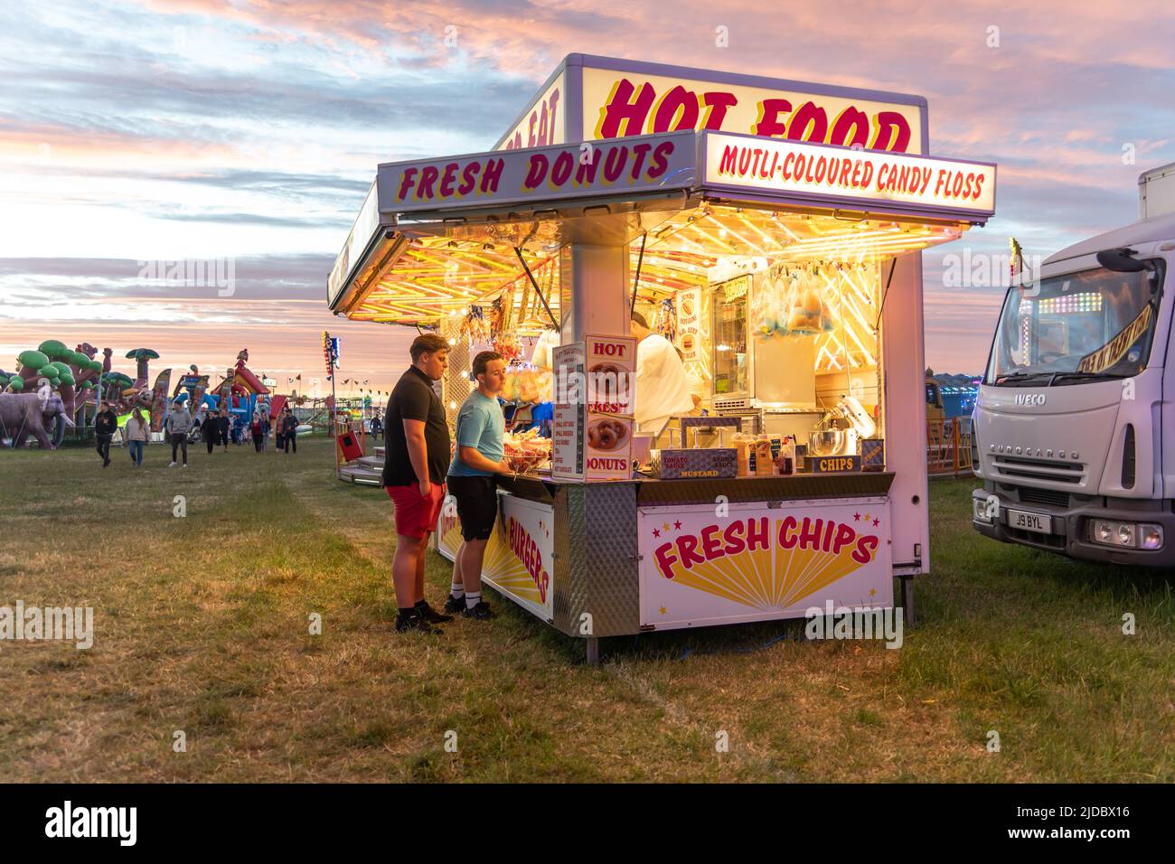 People spending leisure time at the funfair. The 140th 'Hoppings' on ...