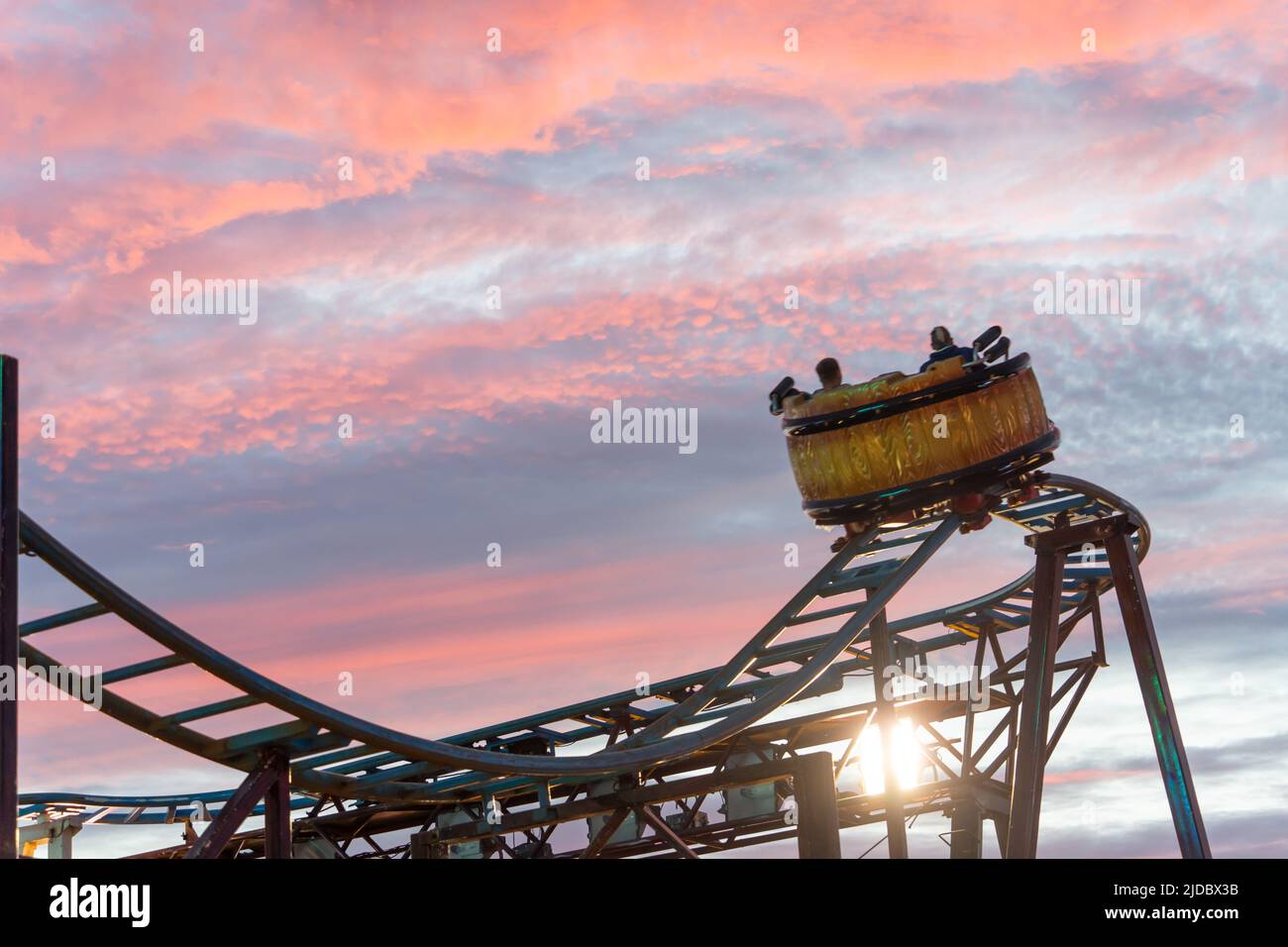 The Magic Mouse mini rollercoaster under a beautiful pink and blue ...
