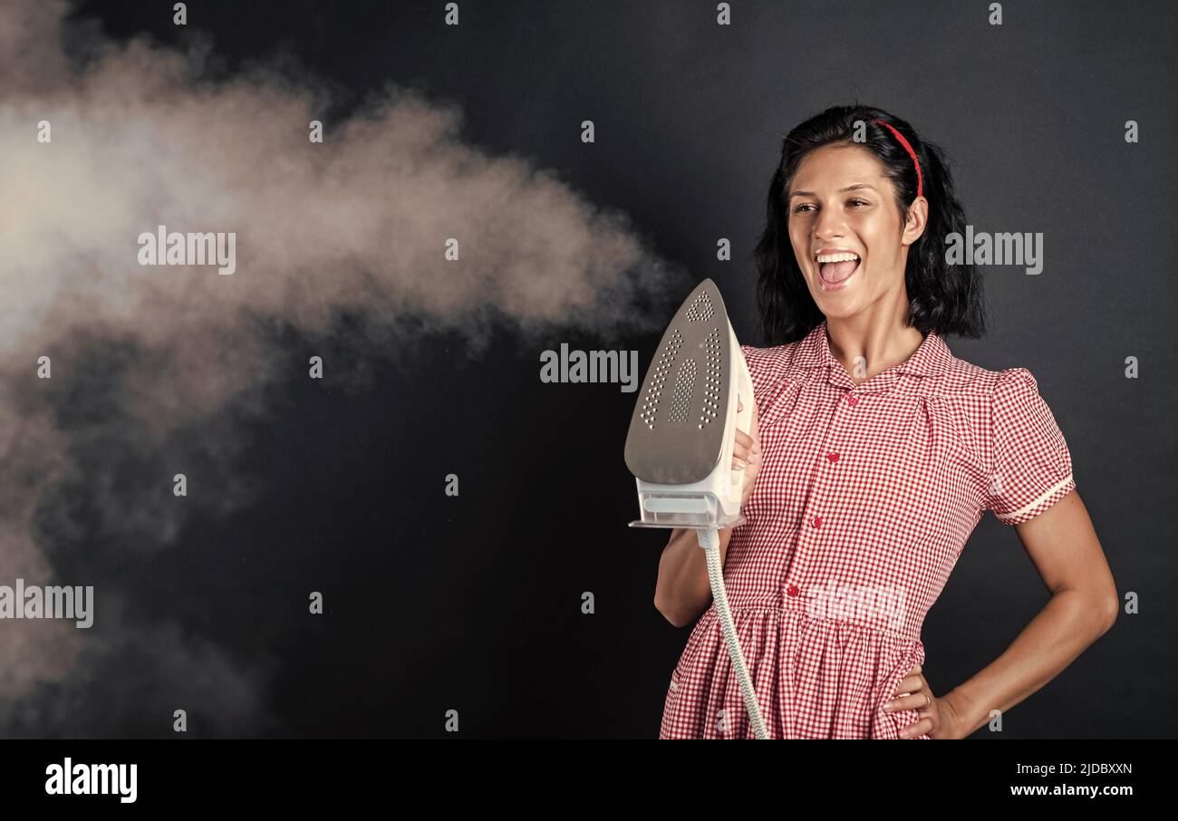 cheerful lady presenting product of steaming iron, maid Stock Photo - Alamy