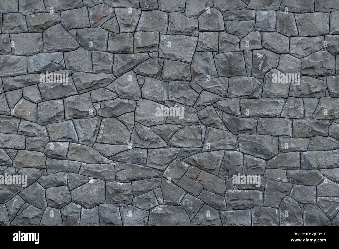 Gray dirty stone wall. Texture of grey granite. Dark rough rocks ...