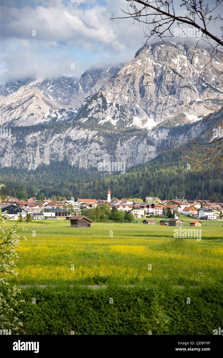 Small village in Austria with the Alps mountains in the background ...