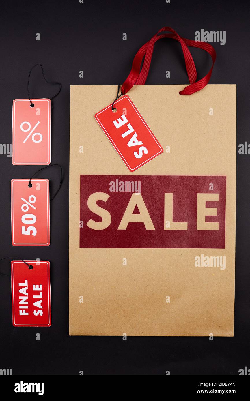 Background image of paperbag with promotion sale tags used to attach to ...