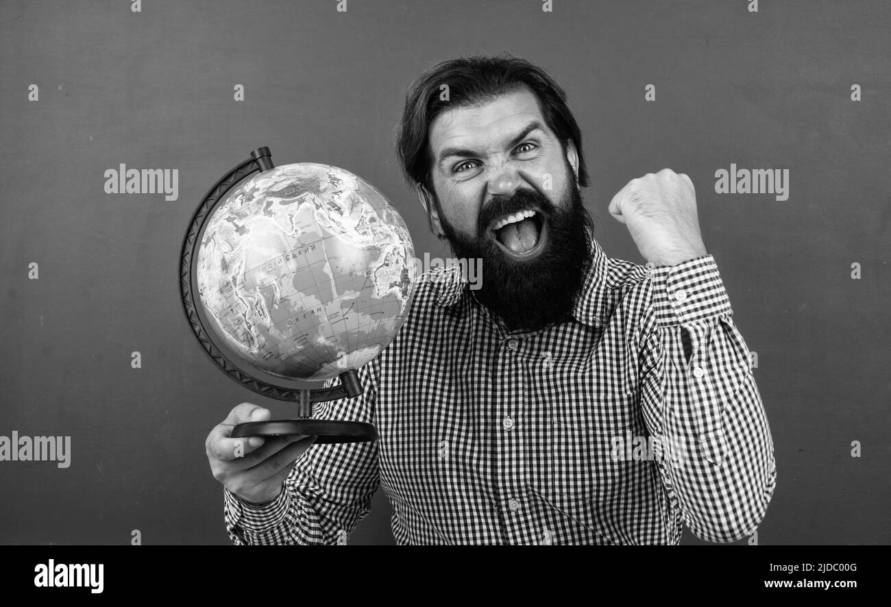 happy geographer man with beard look at globe. ready for studying ...