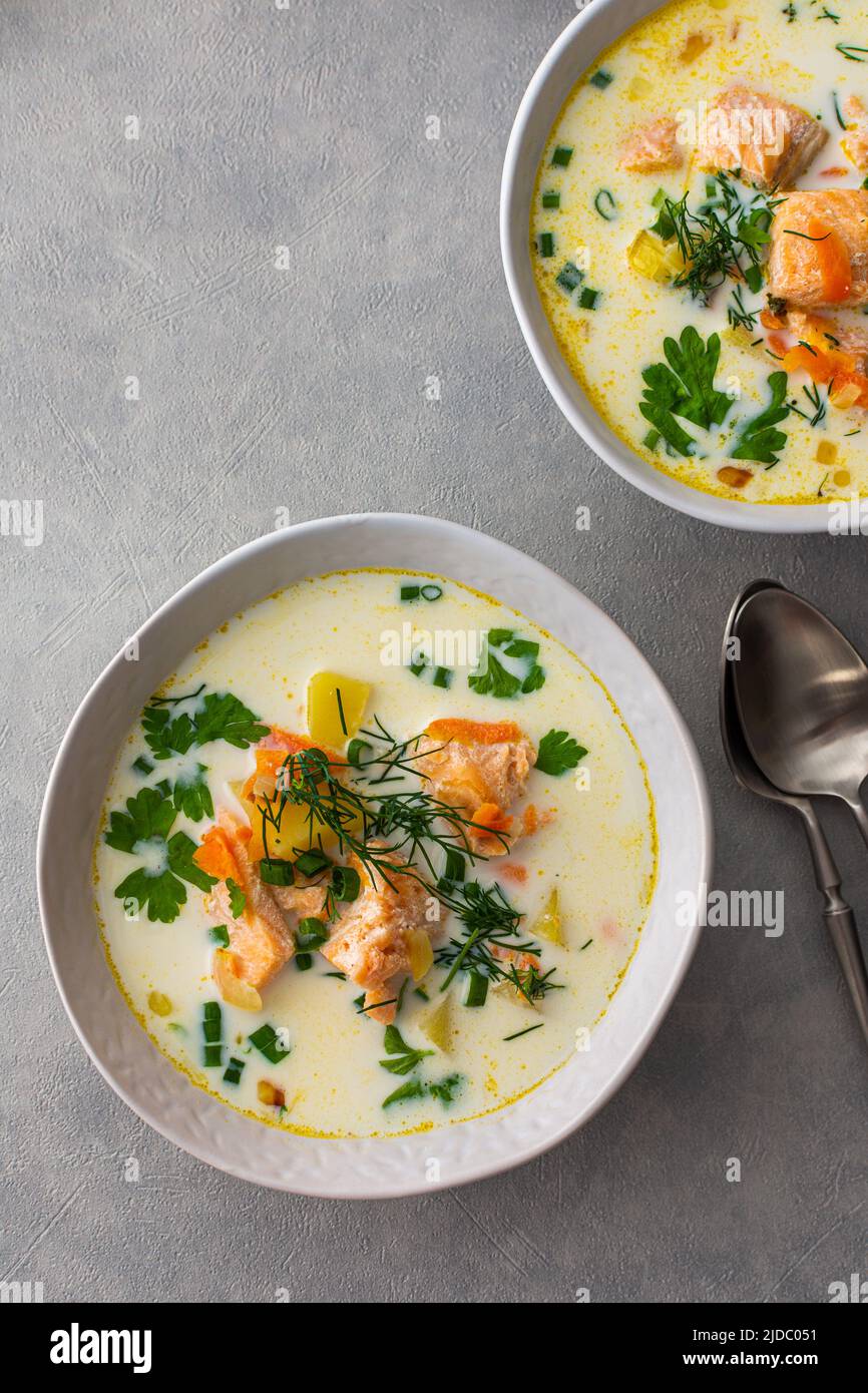 Norwegian salmon red fish soup with vegetables, herbs and cream, top ...