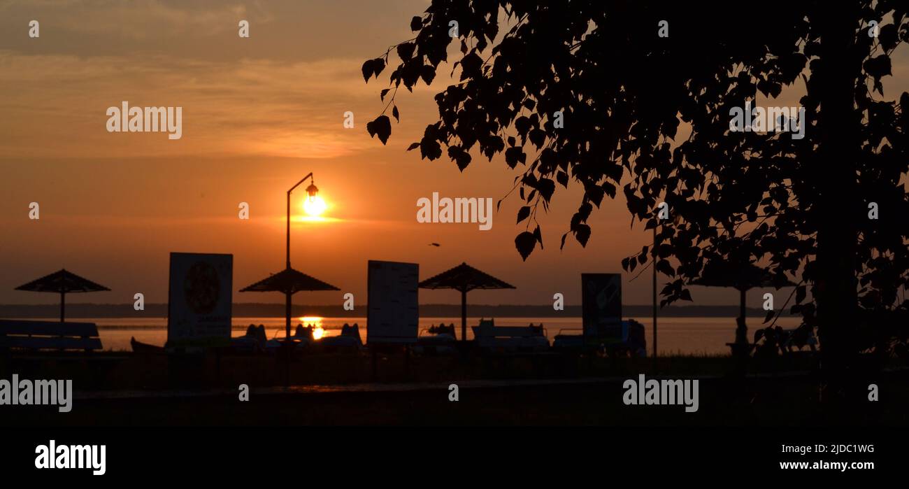 Beautiful sunset. Romantic sunset on the lake. Evening landscape ...