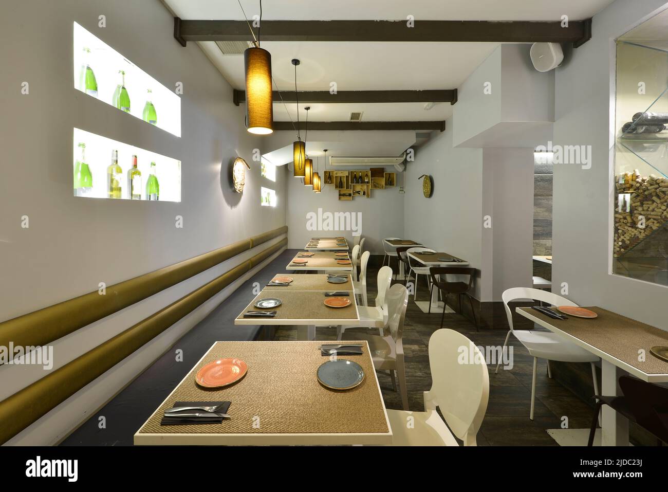 Dining room of a restaurant with square tables with food service set ...