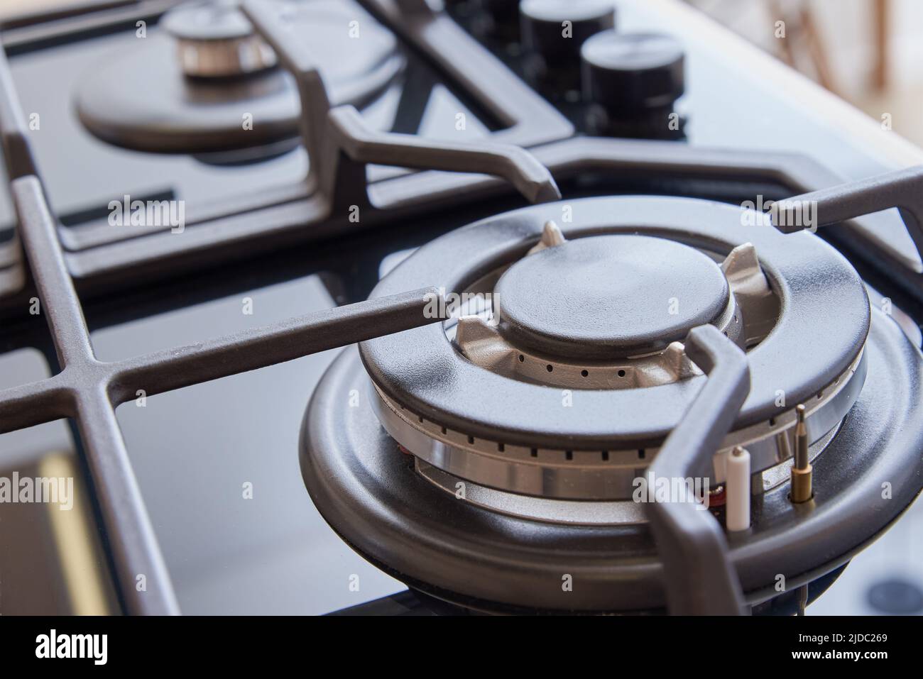 New kitchen stove with gas hob, close up. Modern kitchen appliance ...