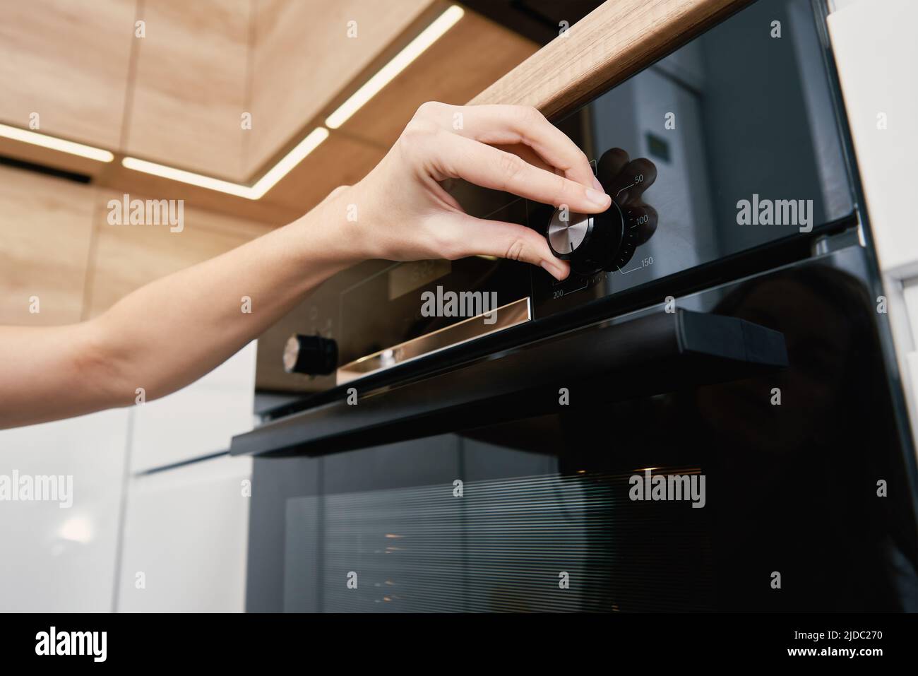 Female hand choose baking program on electric oven control panel, Woman ...