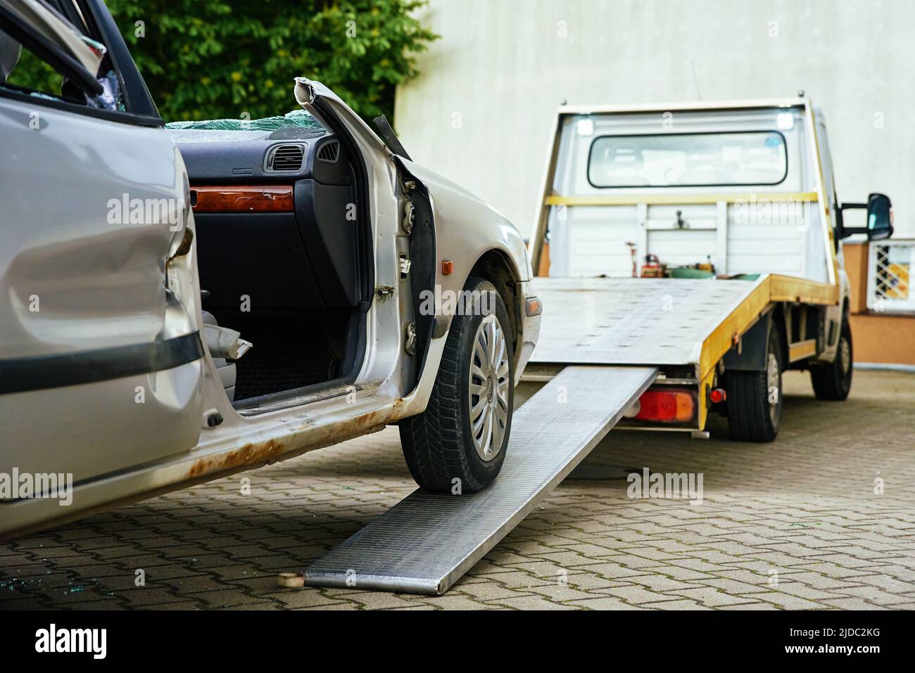 Wrecked car loading on tow truck after crash traffic accident, Concept ...