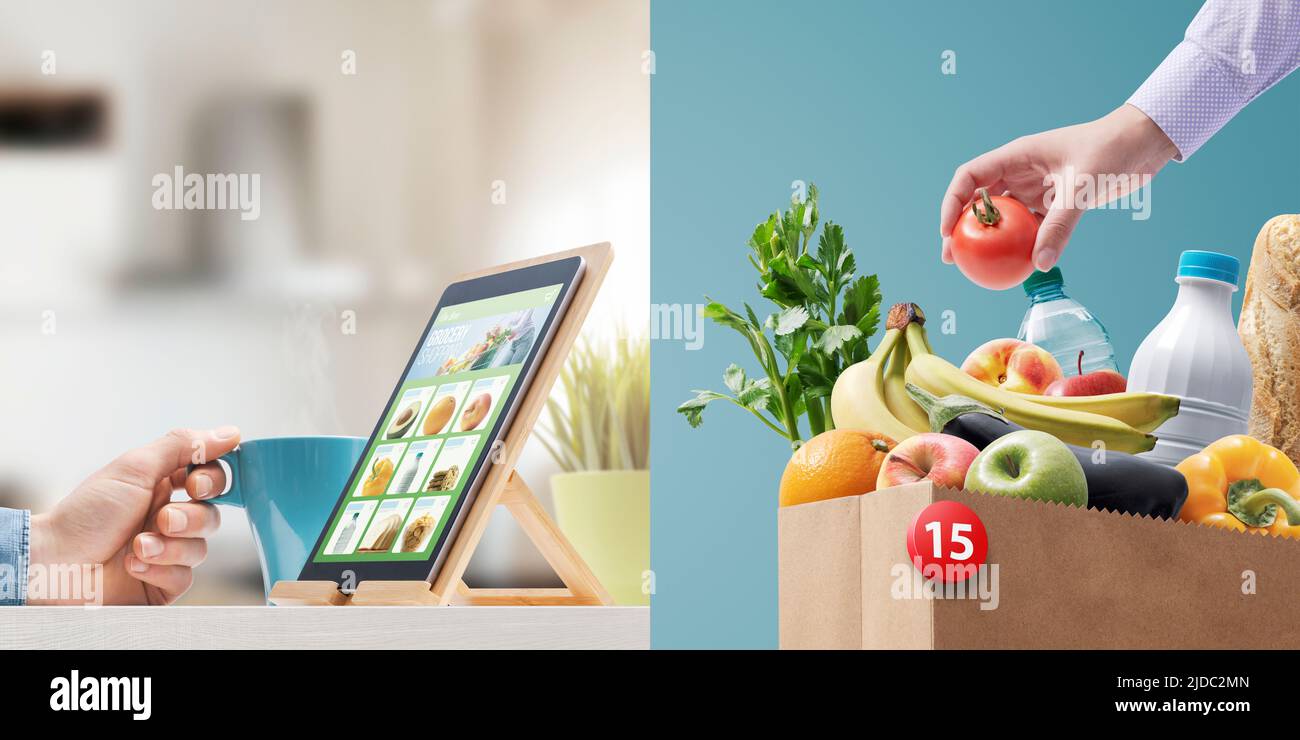 Customer ordering grocery online using a tablet and grocery bag full of ...