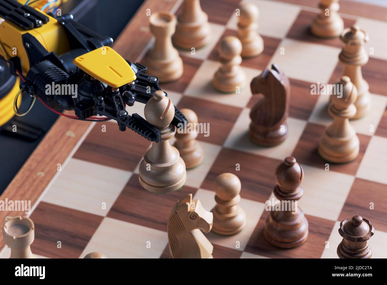 Robot moving chess pieces on chessboard, close up Stock Photo - Alamy