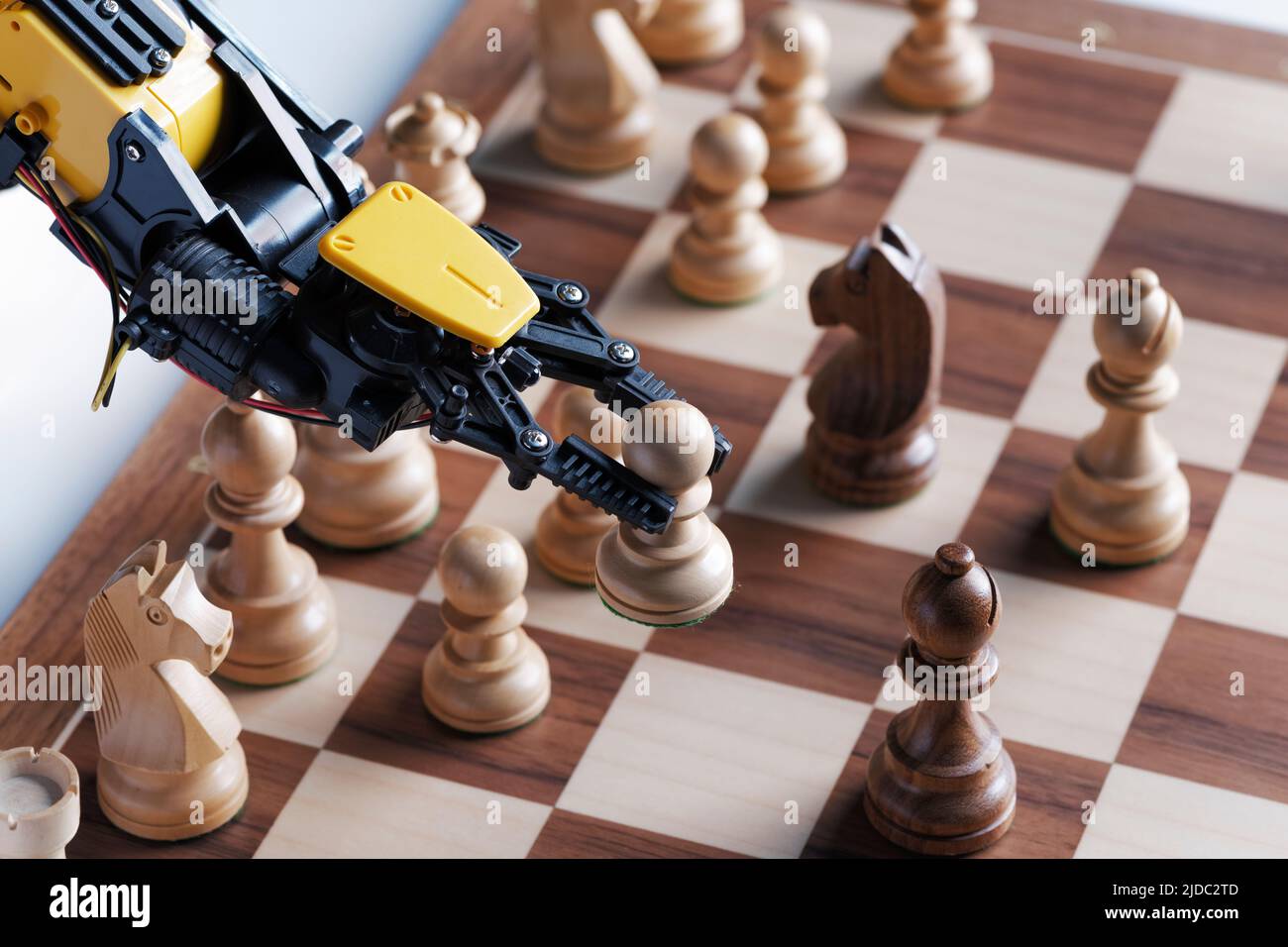 Robot moving chess pieces on chessboard, close up Stock Photo - Alamy