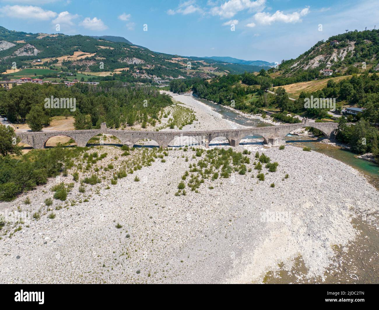 Aerial view. Drought and dry rivers. Roman bridge of Bobbio over the ...
