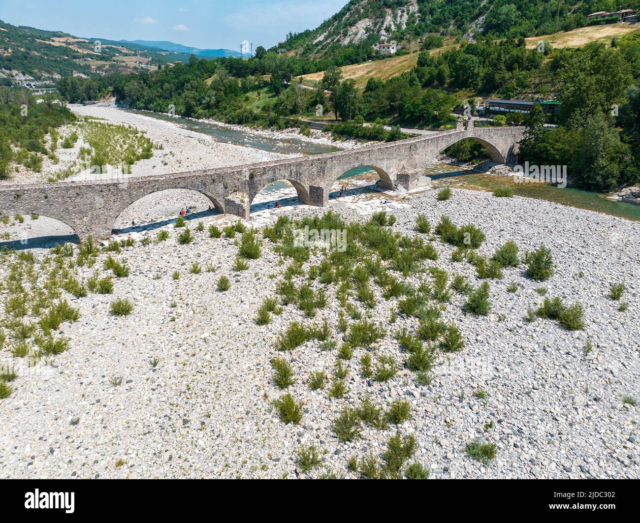 Aerial view. Drought and dry rivers. Roman bridge of Bobbio over the ...