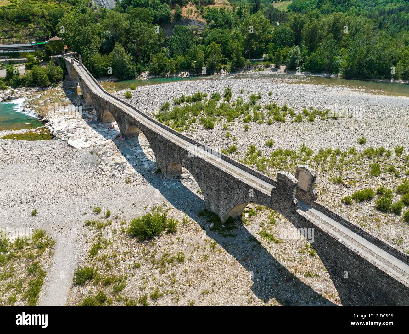 Aerial view. Drought and dry rivers. Roman bridge of Bobbio over the ...