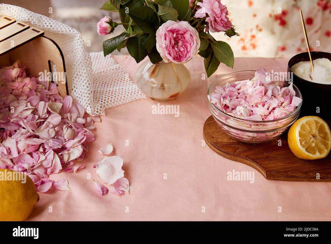 Aesthetic homemade organic rustic tea rose jam preparing with sugar ...