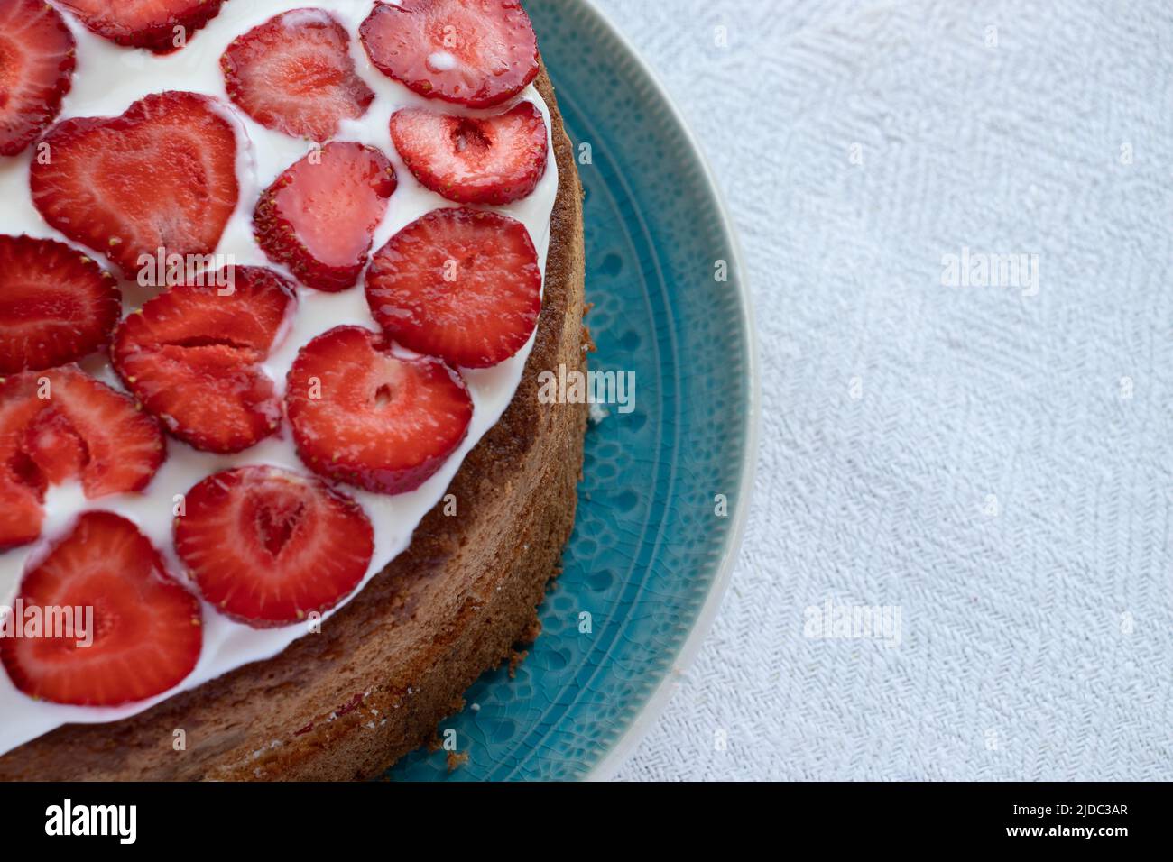 Cake with strawberries and cream on blue plate. Summer Strawberry Layer ...