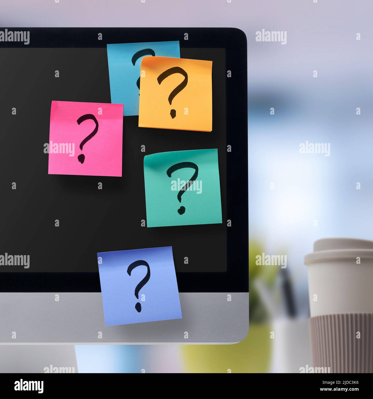 Collection of colorful sticky notes with question marks on computer ...