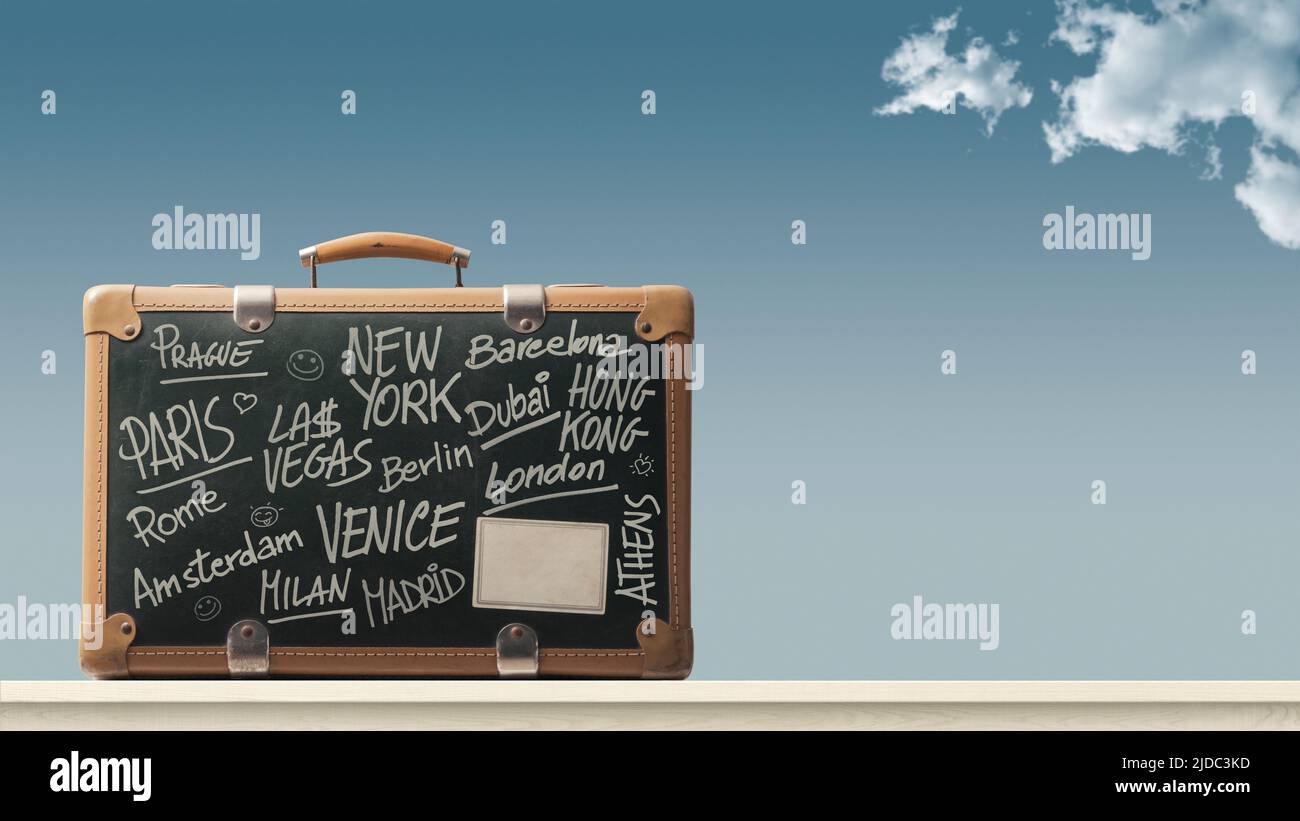 Vintage suitcase with names of capital cities: international travel ...