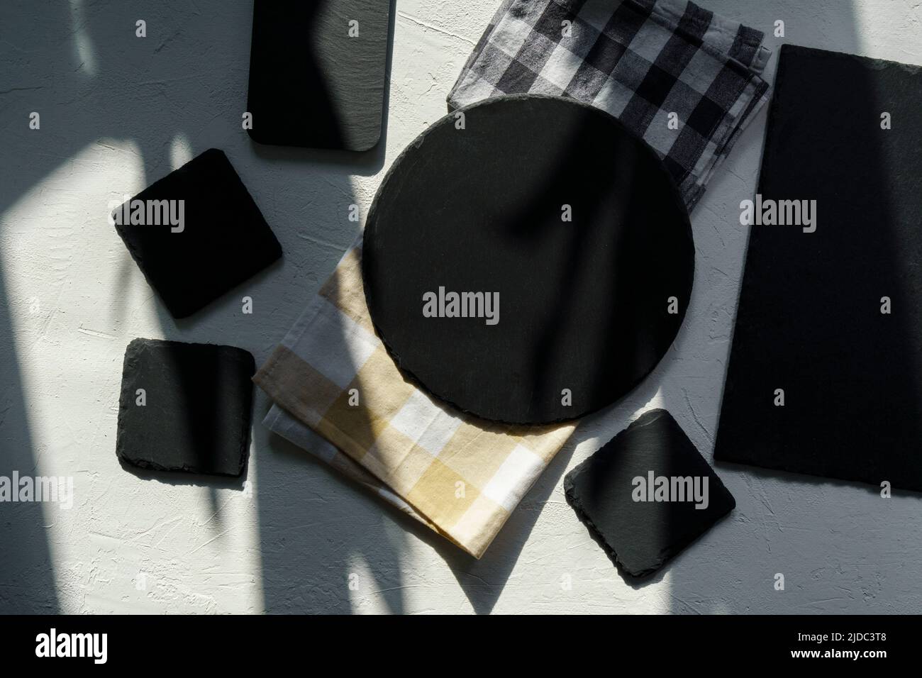 Various cooking boards made of slate white background, top view, space ...