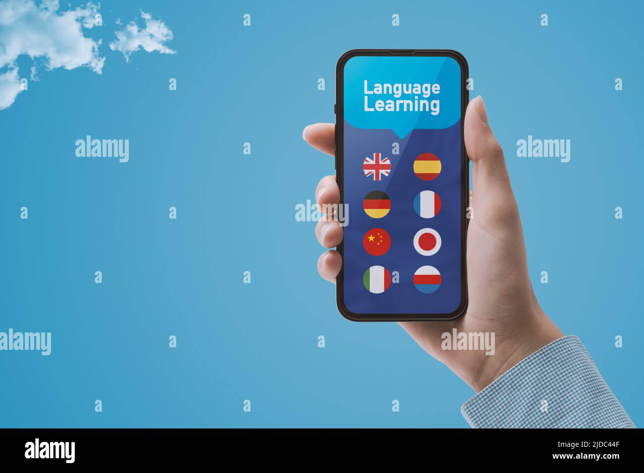 Learn languages online: hand holding a smartphone with language ...