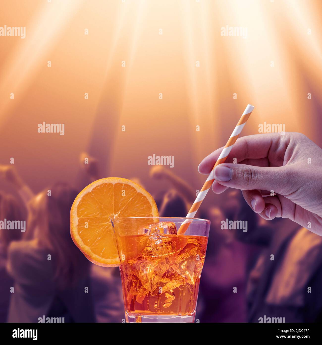 Woman having a delicious cocktail at the nightclub and crowd of people ...