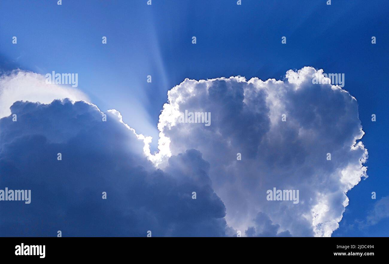 Single white cloud in the blue sky natural background. Deep blue summer ...