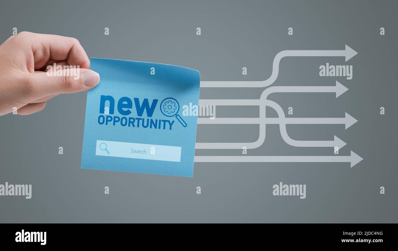 Woman showing how to find new opportunities online, she is holding a ...