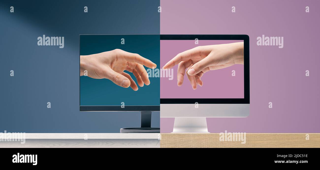 Male and female hands on computer screens reaching for each other ...