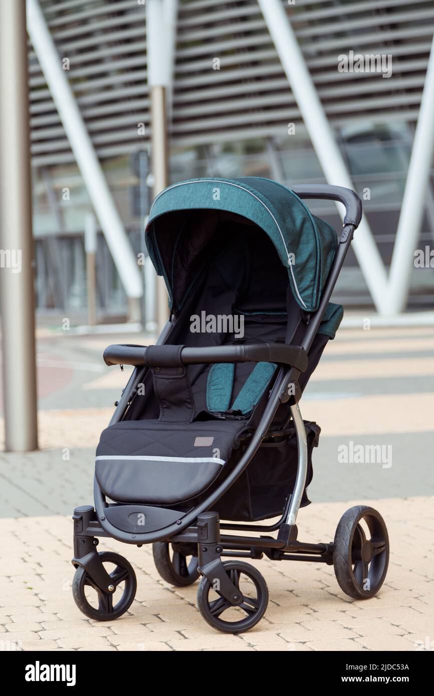 Modern green baby carriage hi-res stock photography and images - Alamy