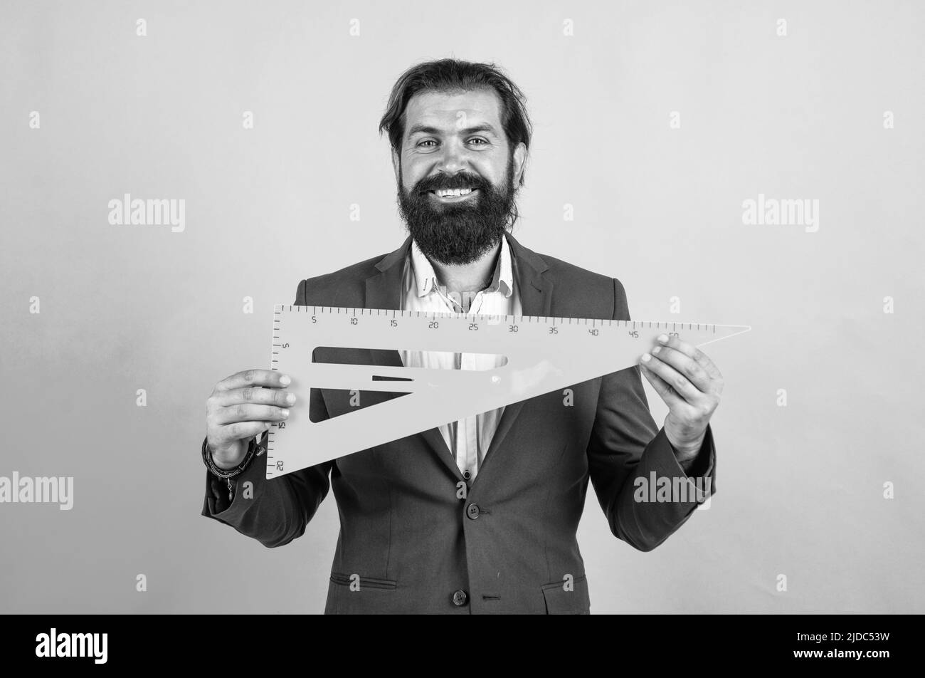Teacher man with happy face holding triangle ruler, back to school ...