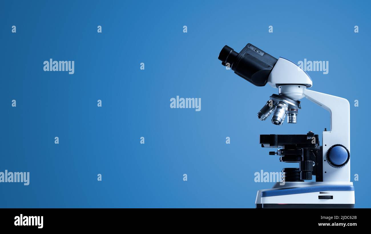 Professional laboratory microscope on blue background, science and ...