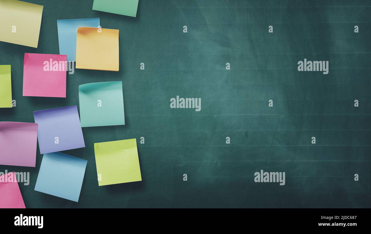 Many sticky notes hanging on a chalkboard, education and learning ...