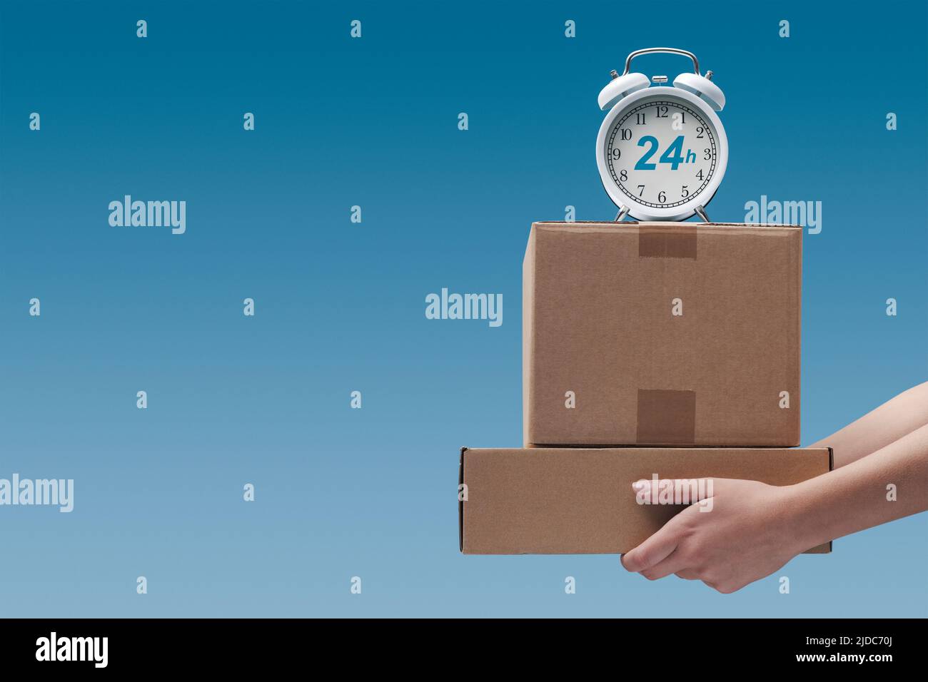 Hands holding delivery boxes and alarm clock: 24 hours delivery service ...