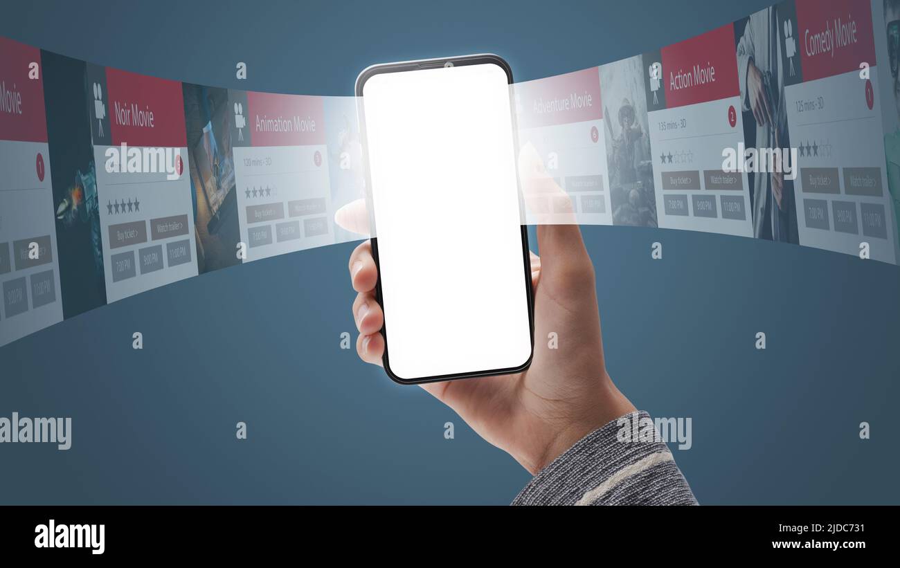 Woman browsing movies online on her smartphone, cinema and ...