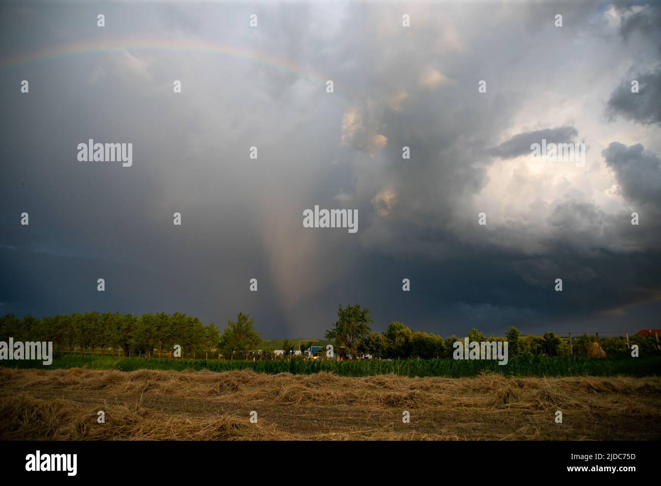 Dramatic sky before storm over summer farmland Stock Photo - Alamy