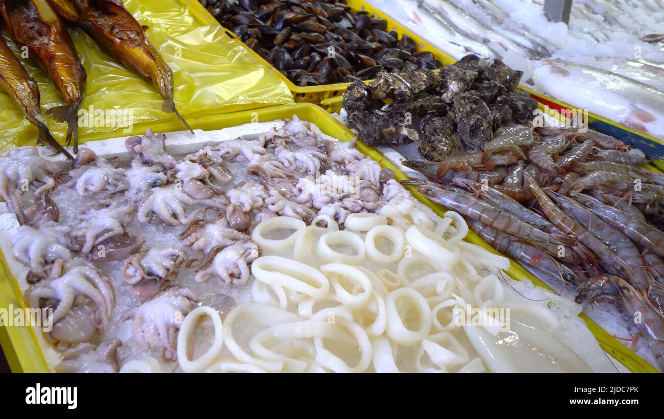 Fresh seafood market in Batumi Georgia. Live fish in ice. Flounder, red ...