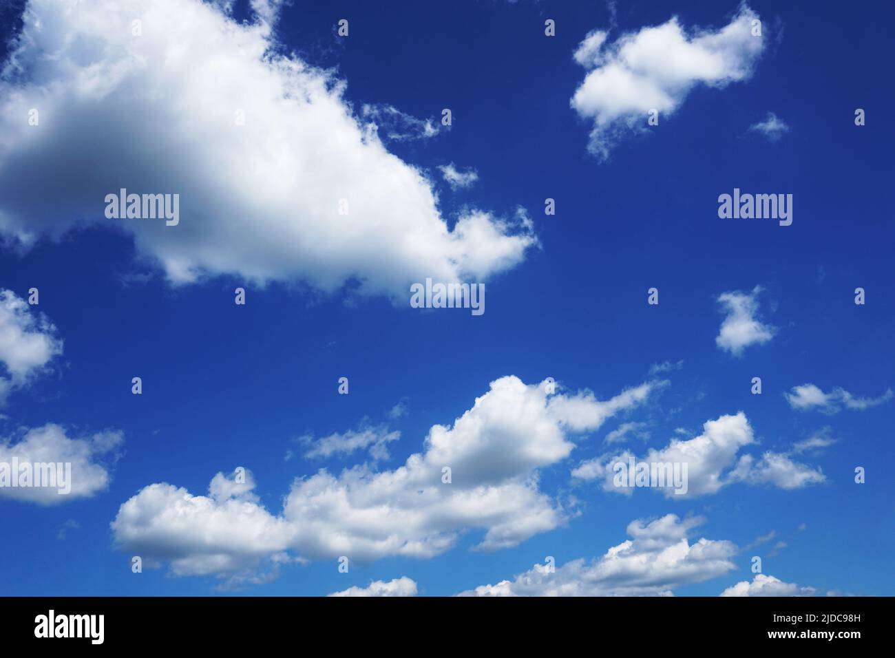 Blue sky with small cumulus clouds Stock Photo - Alamy
