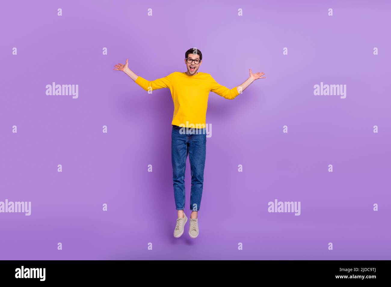 Full length photo of funky cheerful good mood man jumping up fool ...