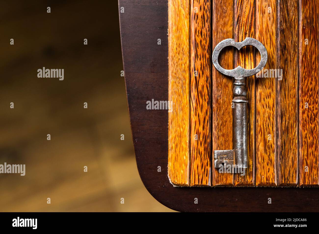 the old key lies on an old wooden table, natural textures, the concept ...