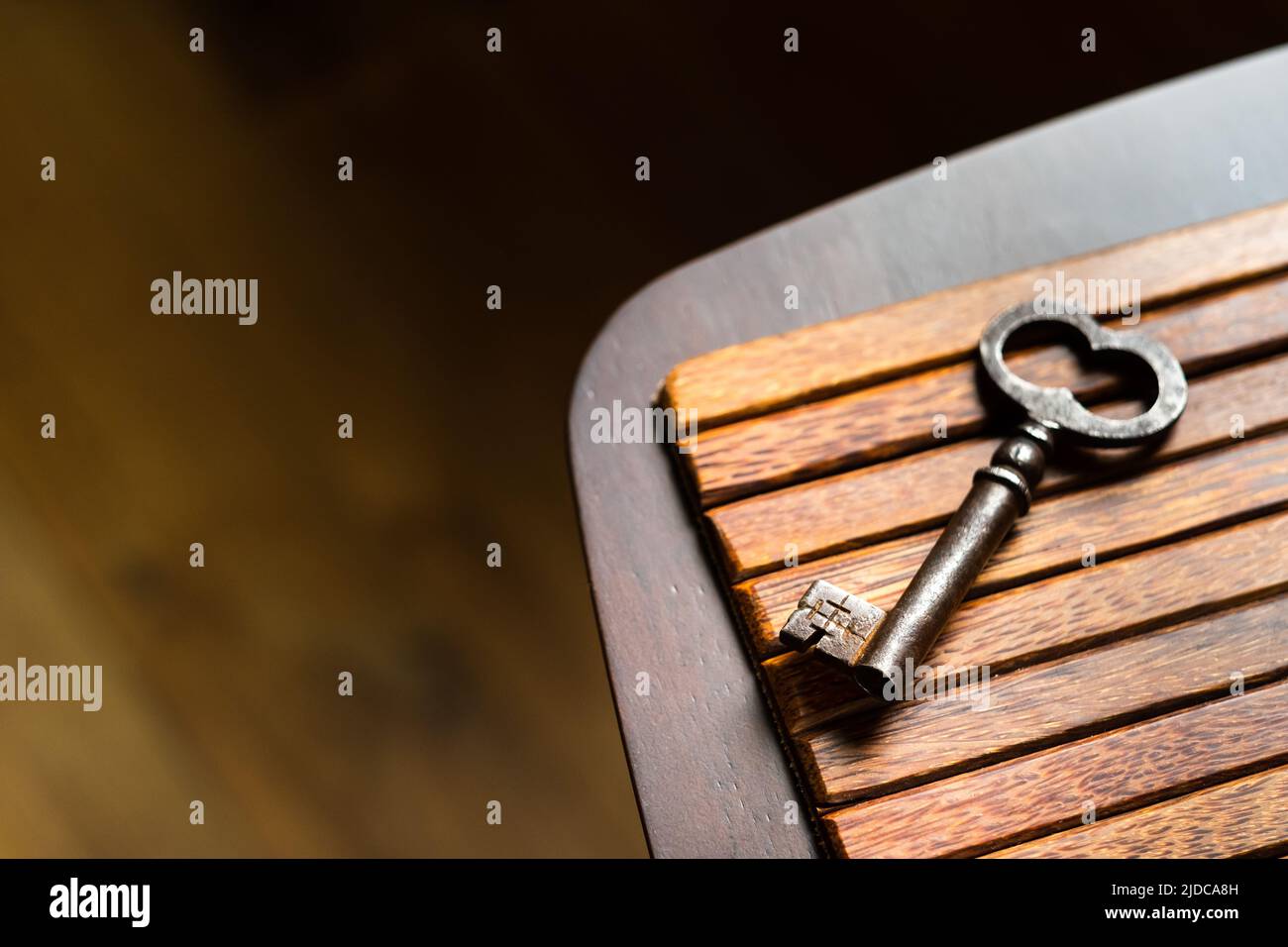 the old key lies on an old wooden table, natural textures, the concept ...