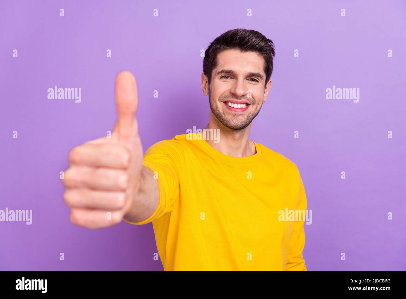 Photo of cheerful good mood male showing you thumb-up self promotion ...