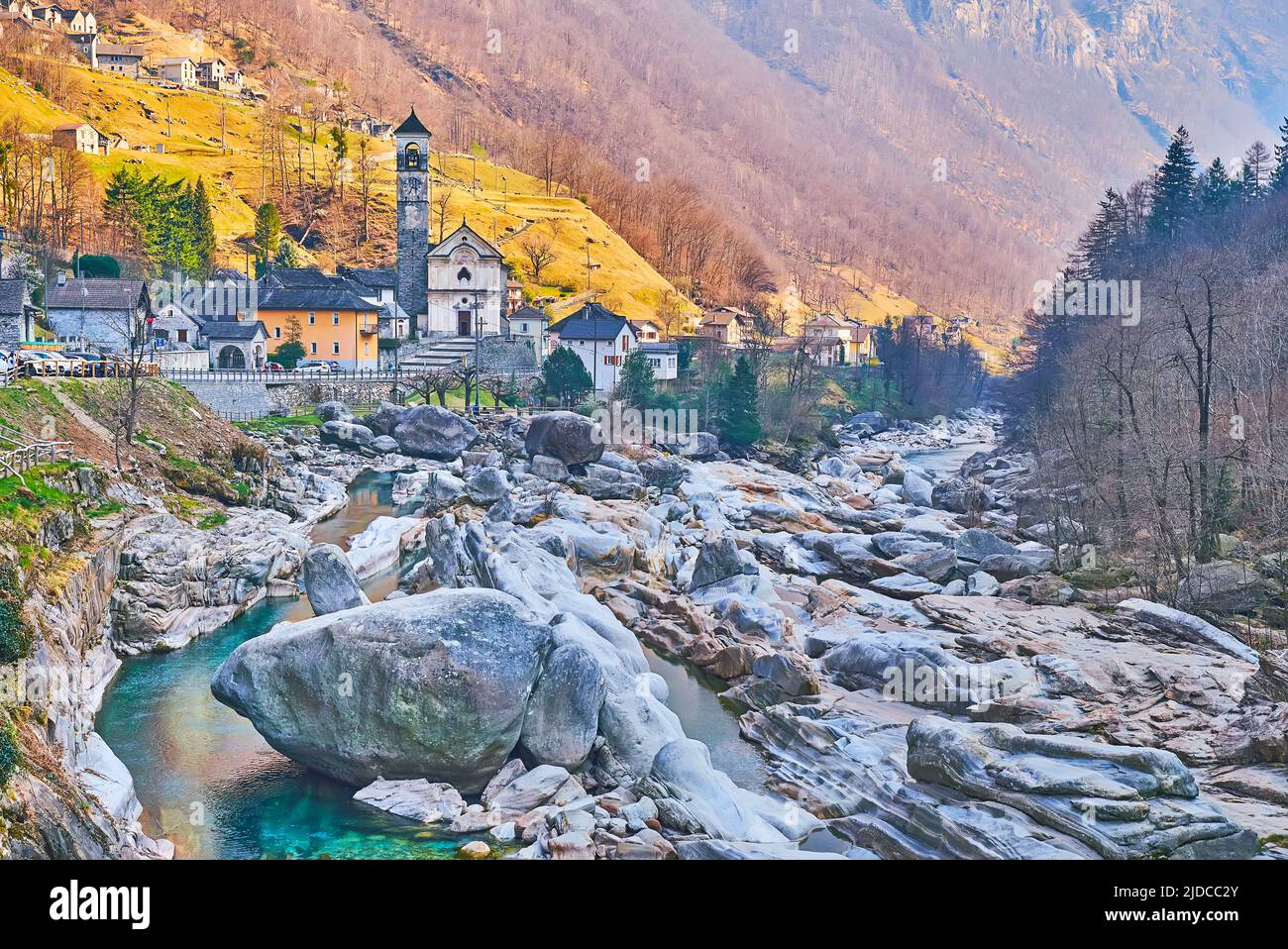 The rocky riverbed of Verzasca River and the medieval church of Santa ...