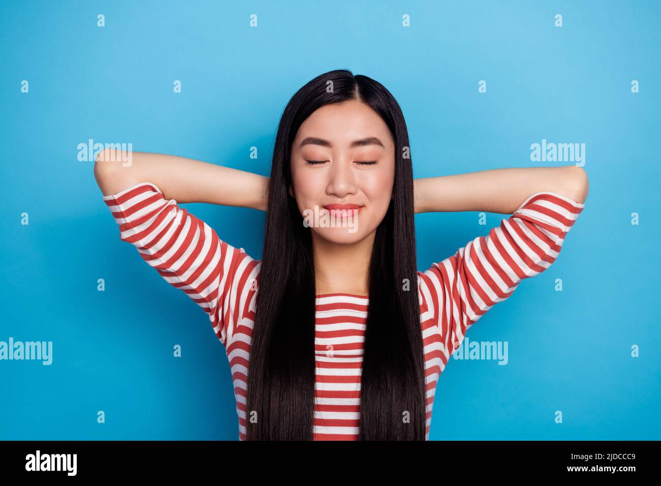 Portrait of calm adorable girl closed eyes hands behind head take nap ...