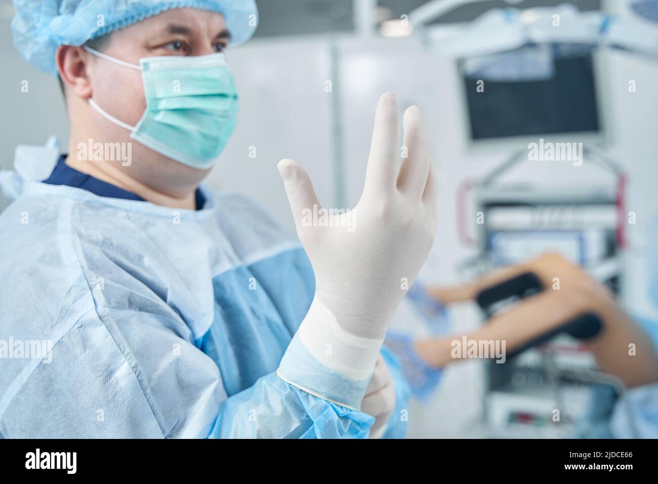 Serious male gynecologist preparing for the examination Stock Photo - Alamy