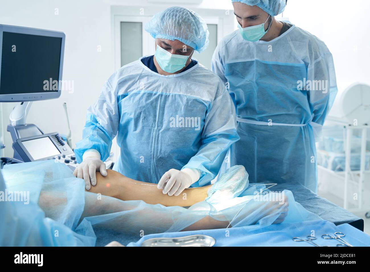 Phlebologists treating multifunctioning veins in the hospital Stock ...