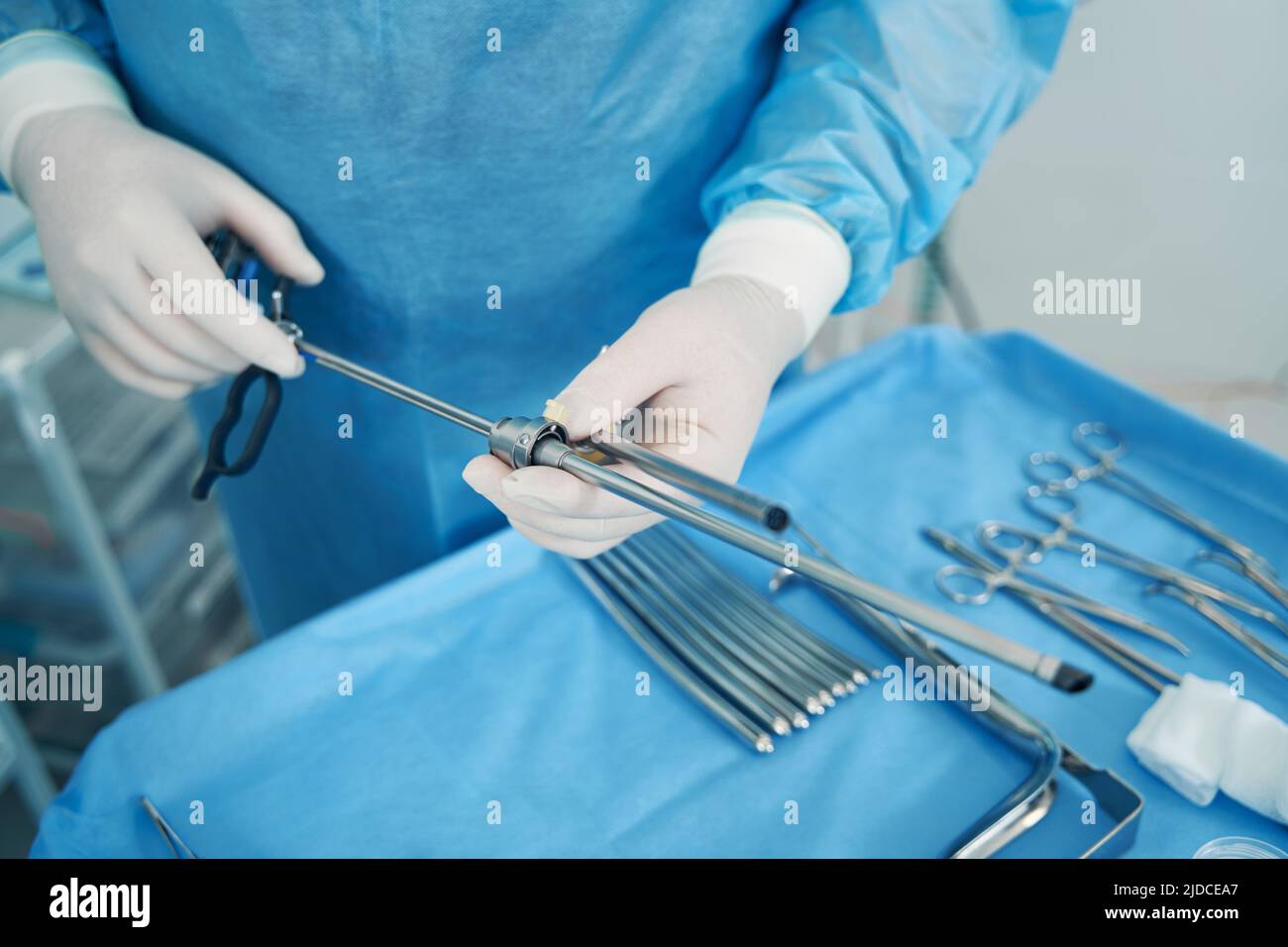 Unrecognized gynecologist holding sterile hysteroscope in the clinic ...