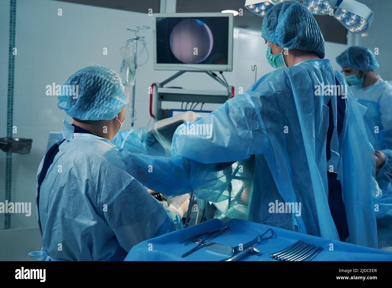 Doctors performing hysteroscopy procedure in the operating room Stock ...