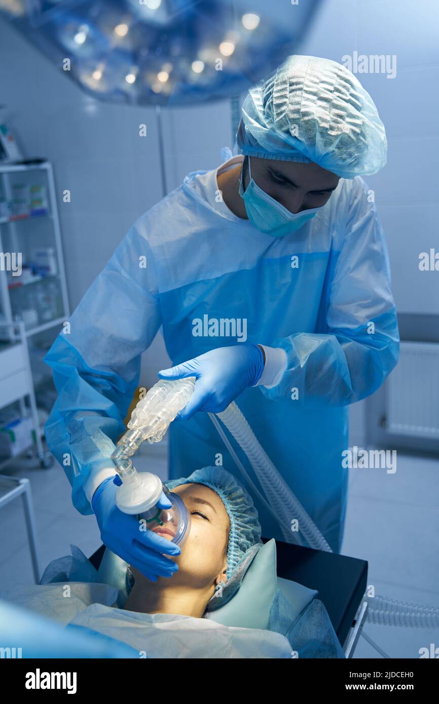 Medical worker maintaining general anesthesia before the surgery Stock ...