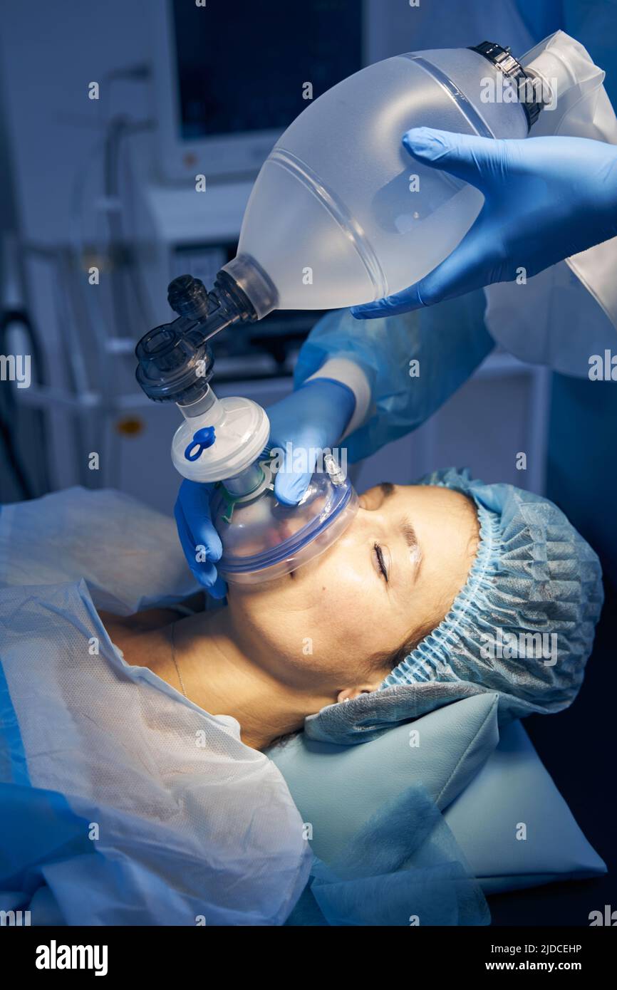 Female patient getting anesthesia before the operation Stock Photo - Alamy